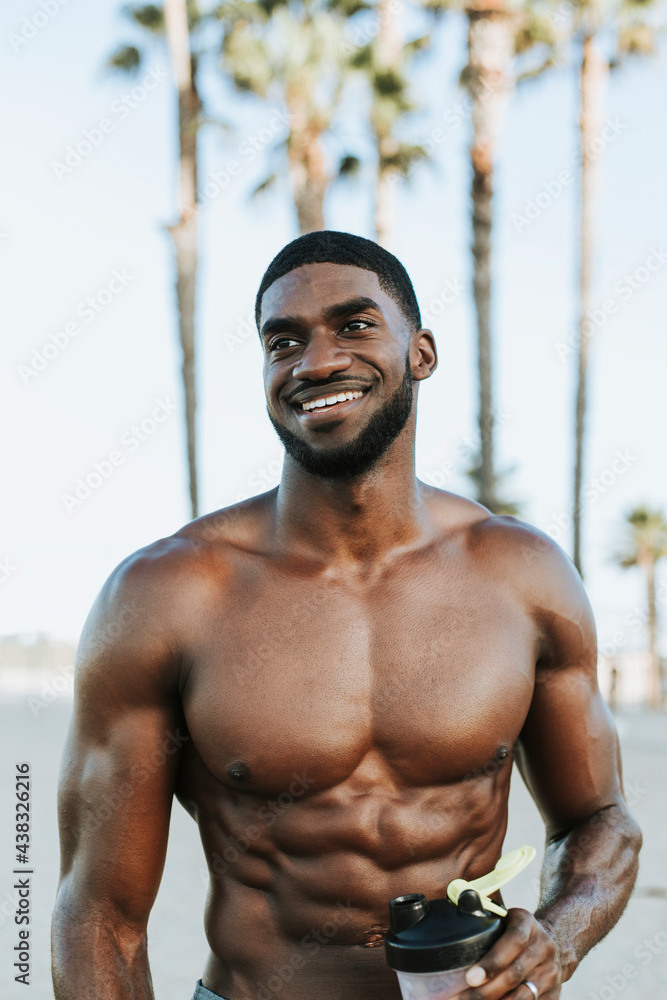 Muscular man drinking a protein shake Stock Photo | Adobe Stock