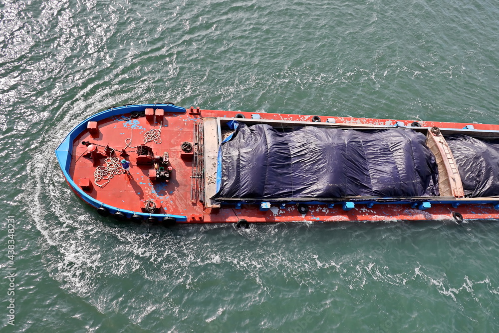 Seagoing vessels, barges, tugboats and small boats at the roadstead of ...