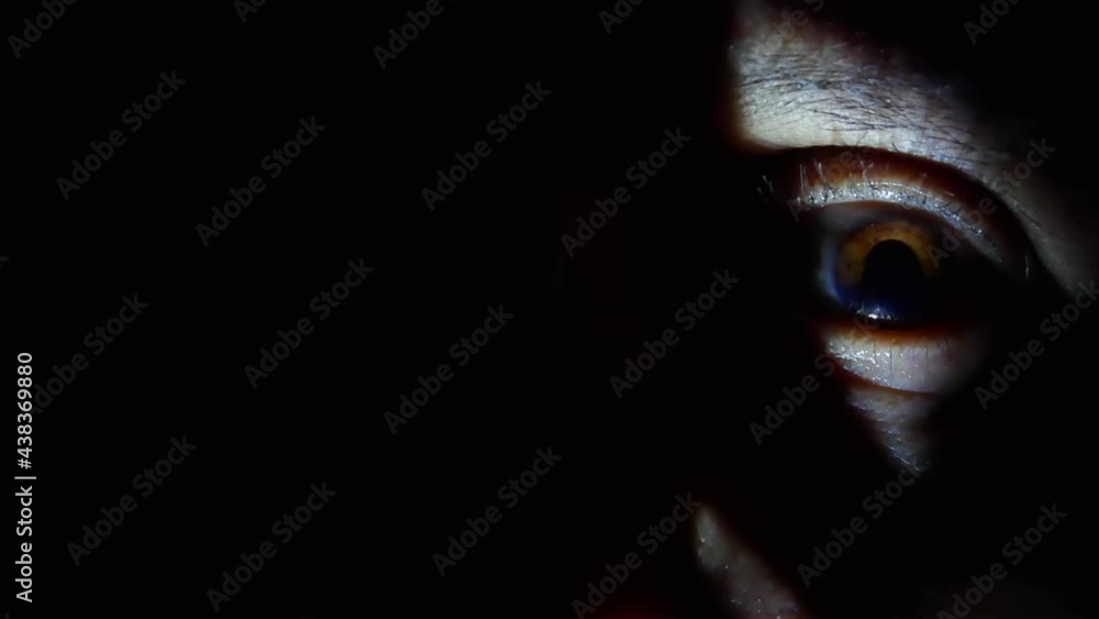 Close up mysterious eye in the night with chiaroscuro, freezing and ...