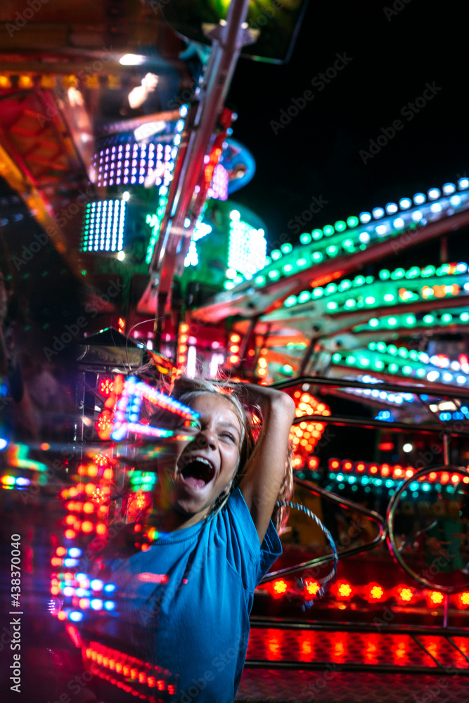 Little girl having exciting experience in the roller coaster Stock ...
