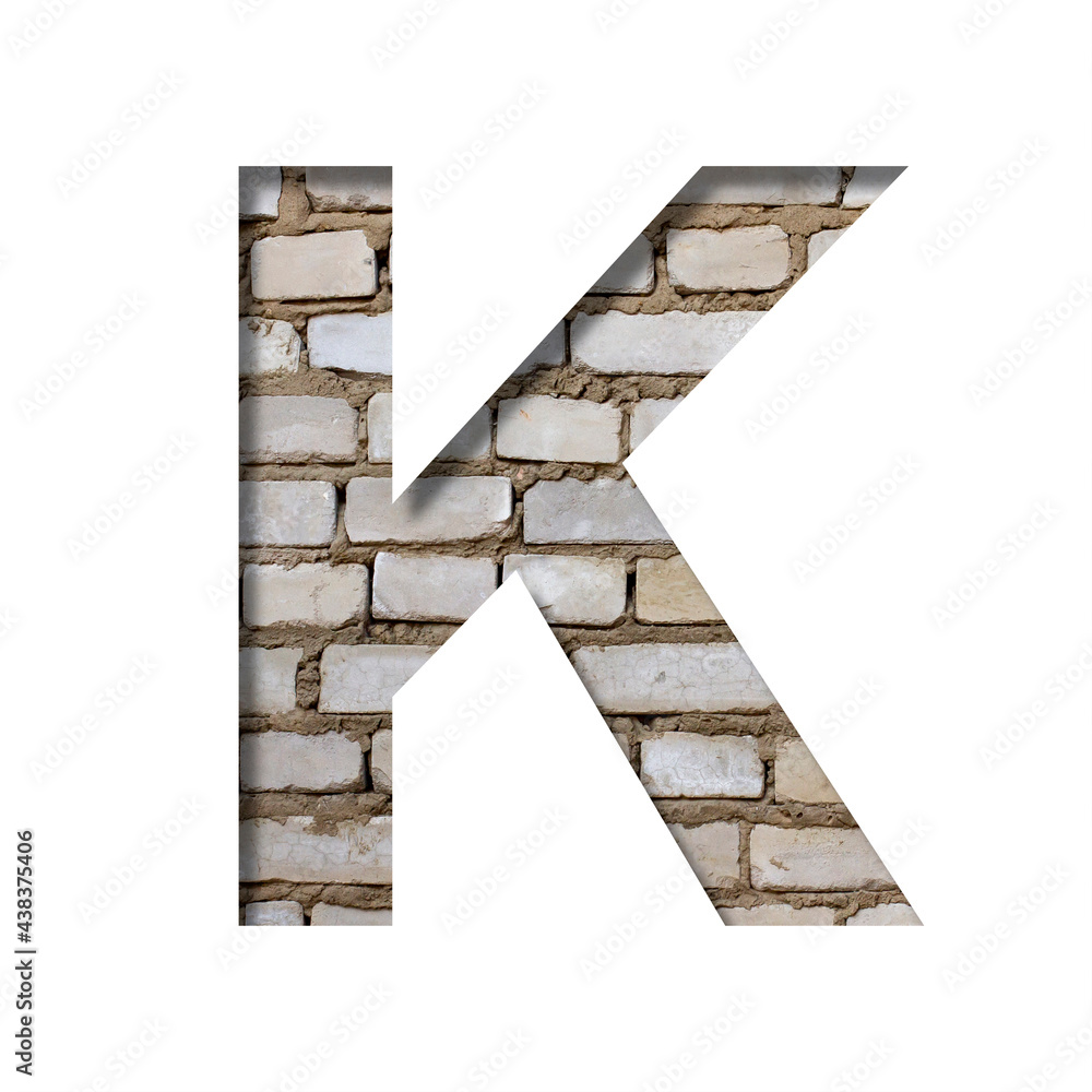 Font on white brick. The letter K is cut from white paper the ...
