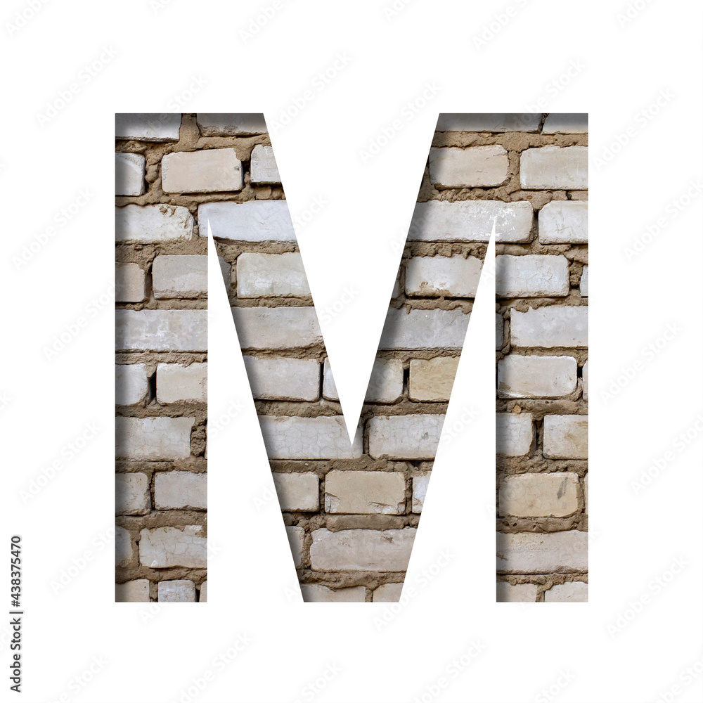 Font on white brick. The letter M is cut from white paper the ...
