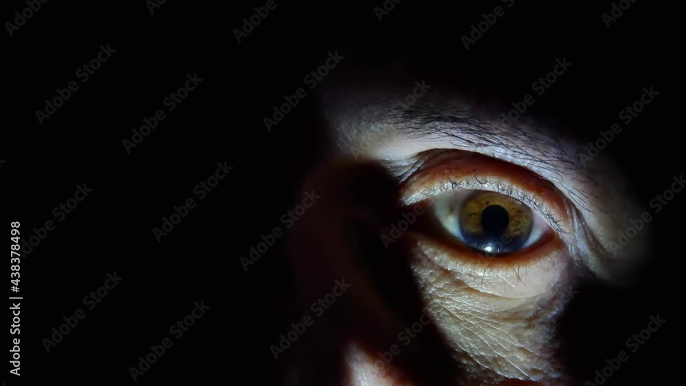 Close up mysterious eye in the night with chiaroscuro, freezing and ...