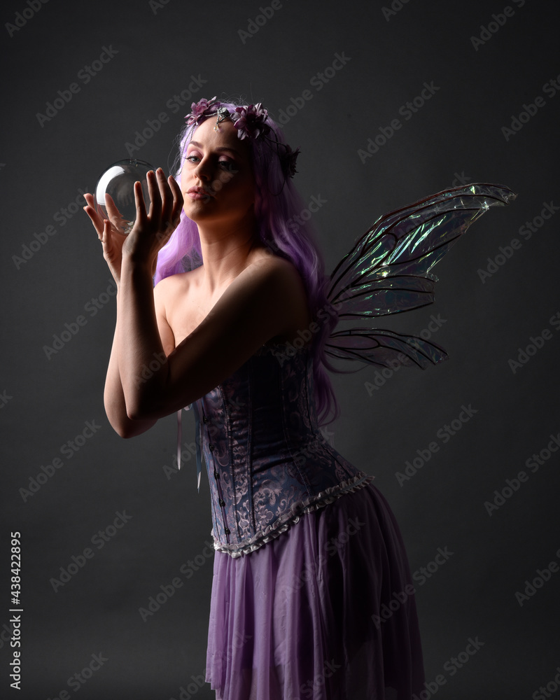 Close up portrait of a purple haired girl wearing fantasy corset dress ...