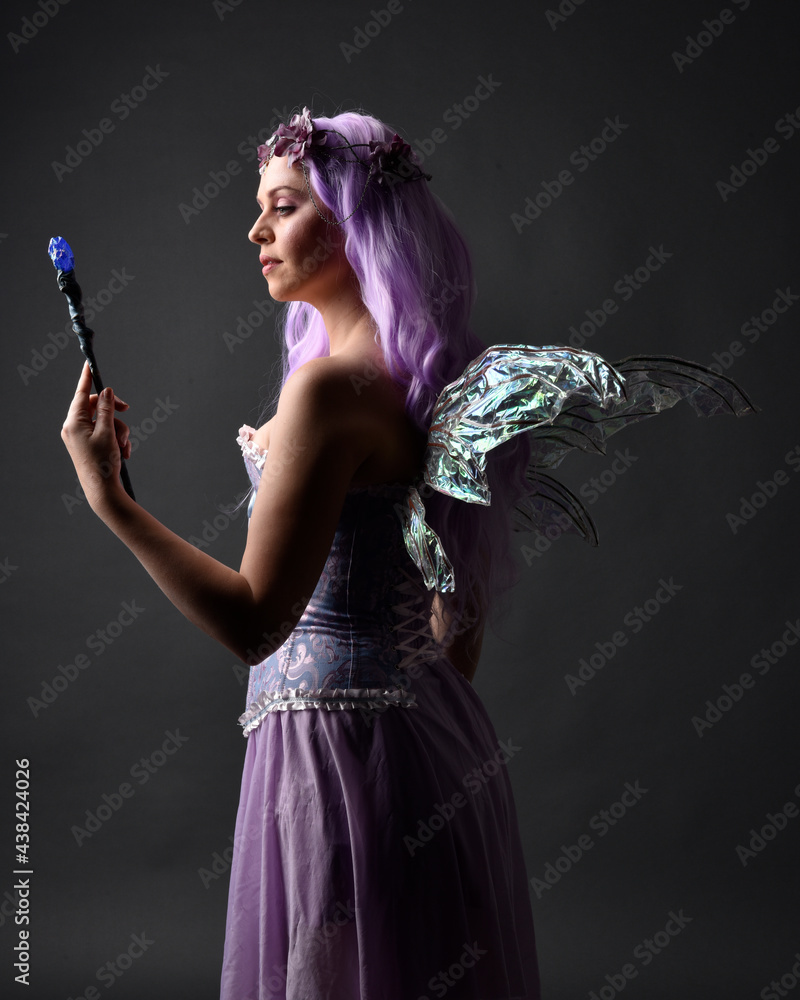 Close up portrait of a purple haired girl wearing fantasy corset dress ...
