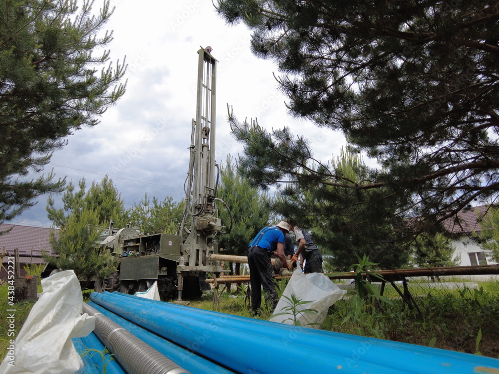 Europe, Kiev region, Ukraine - June 2021: An engineer is drilling a ...