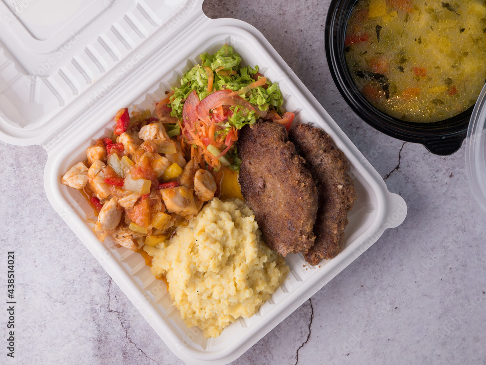 Business lunch in eco plastic container ready for delivery.Top view ...