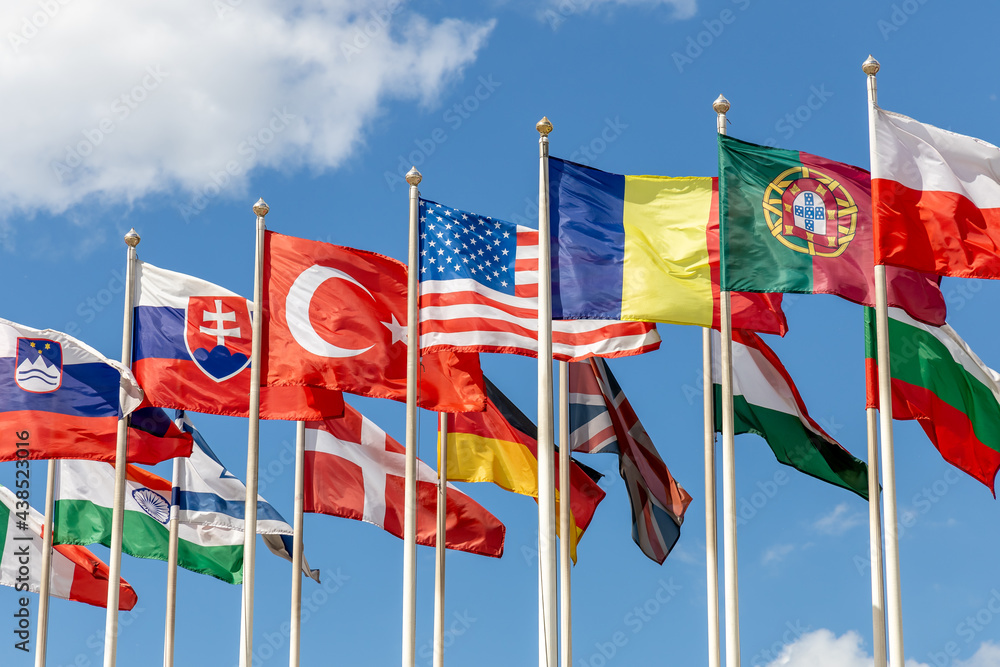 Group of flags of various states - as a symbol of world cooperation ...