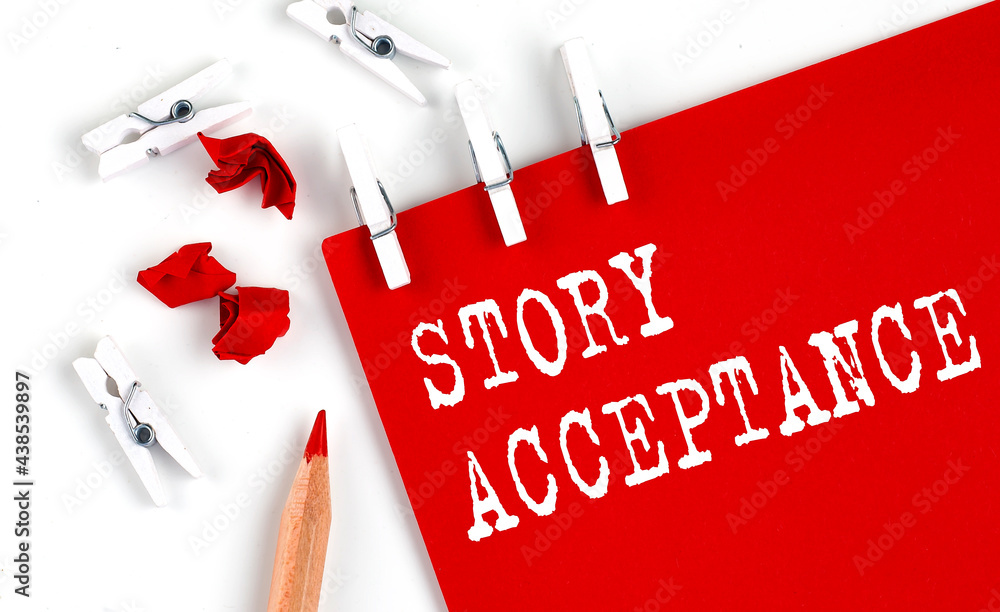 STORY ACCEPTANCE text on red paper with office tools on the white ...