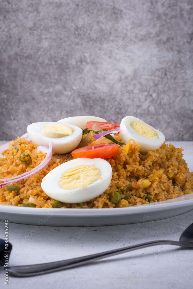 rice noodle dish, also known as string hoppers biryani with boiled eggs ...