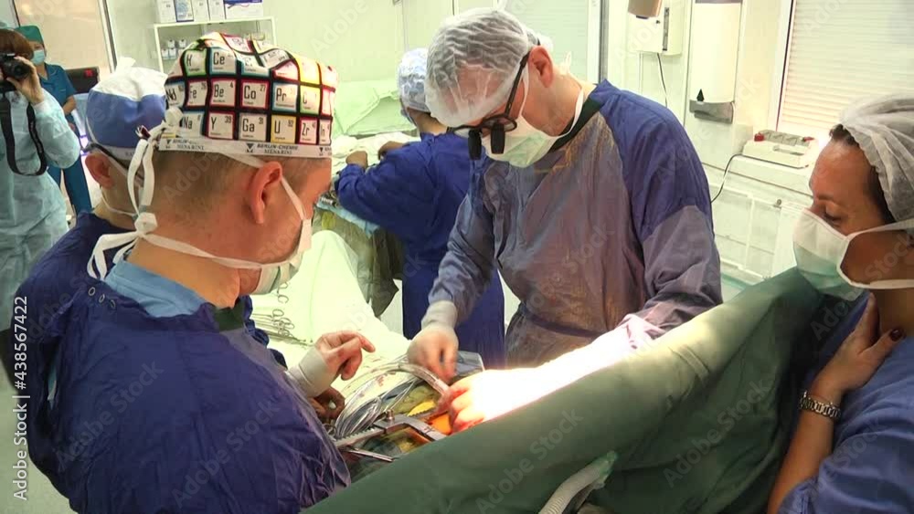 heart surgery. The surgeon in the operating room performs heart surgery ...