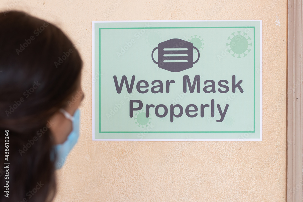 Shoulder Shot of Young girl Student adjusting mask by seeing wear mask ...