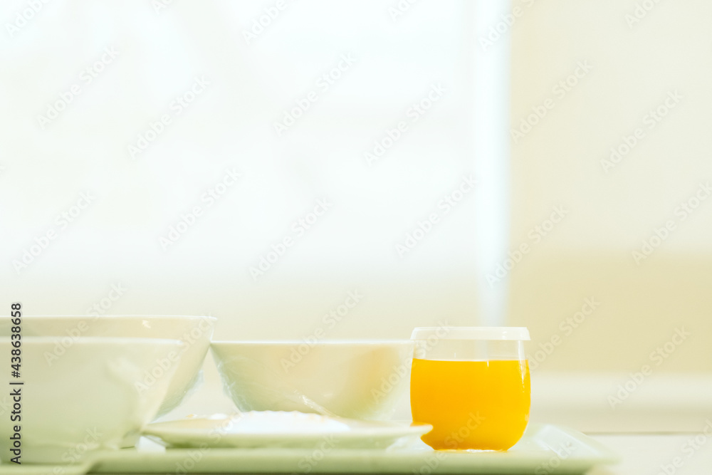 Food tray on the table in a room of a hospital. Patient and hospital ...