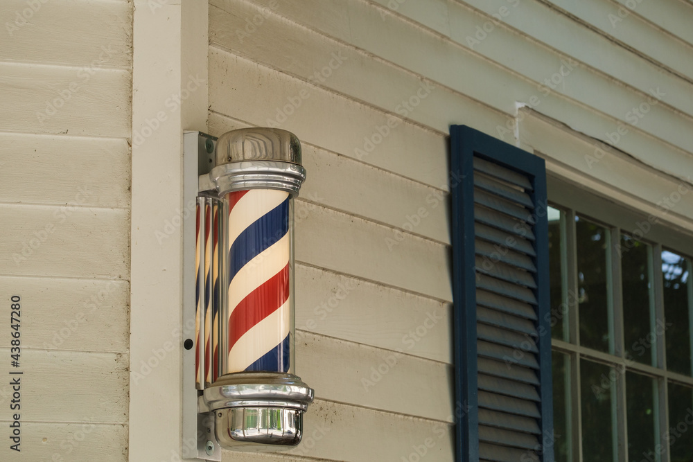 Vintage Red, White and Blue Barber Pole on Side of Barber Shop Stock ...