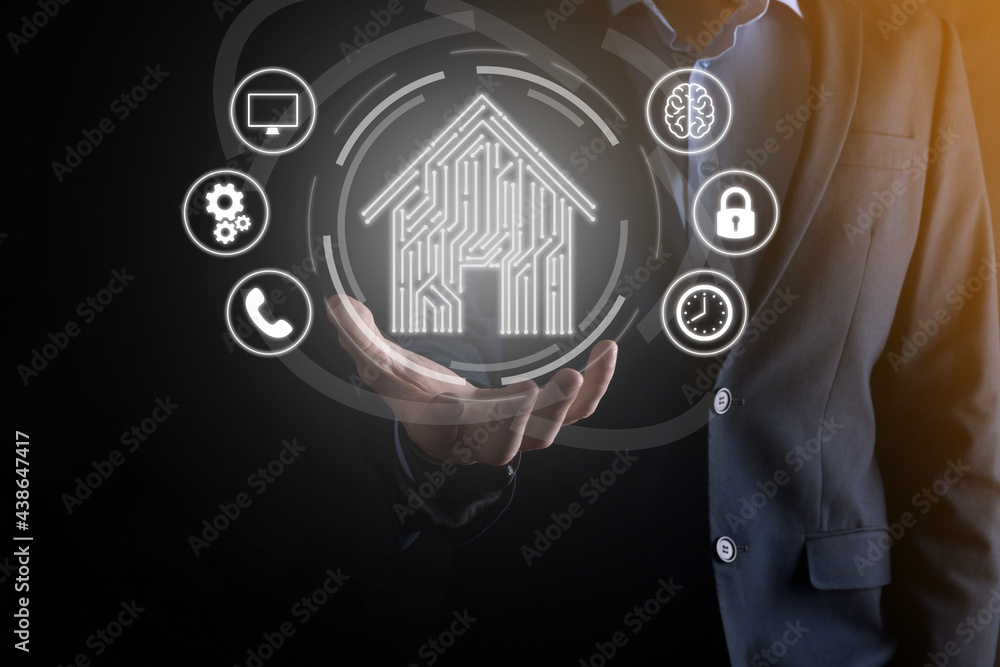 Businessman hold house icon.Smart home controlled, intelligent house ...