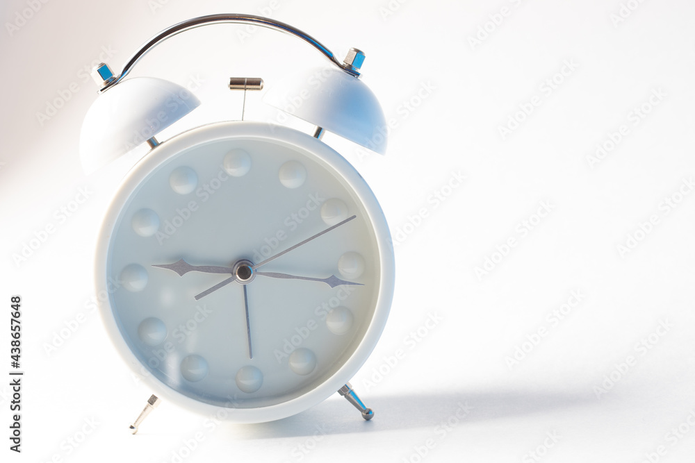 White analog clock on white background with blue highlight Stock Photo ...