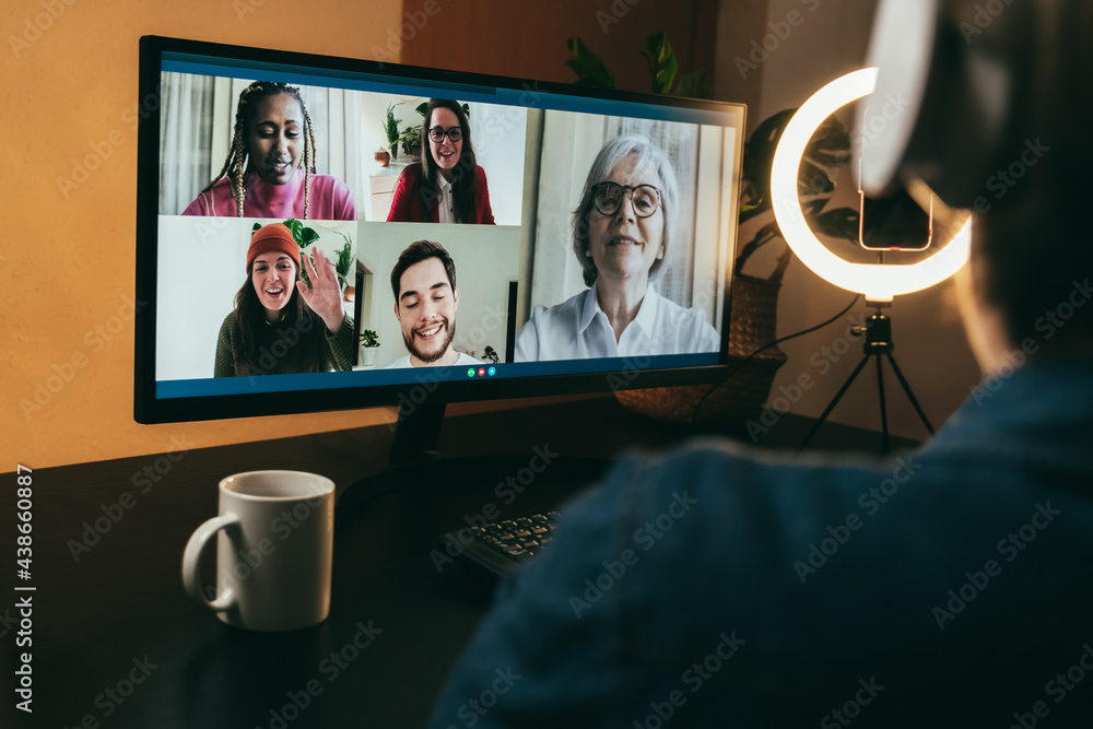 Multi generational business people doing video call using computer app ...