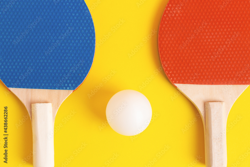 Colorful background with blue and red table tennis rackets and white ...