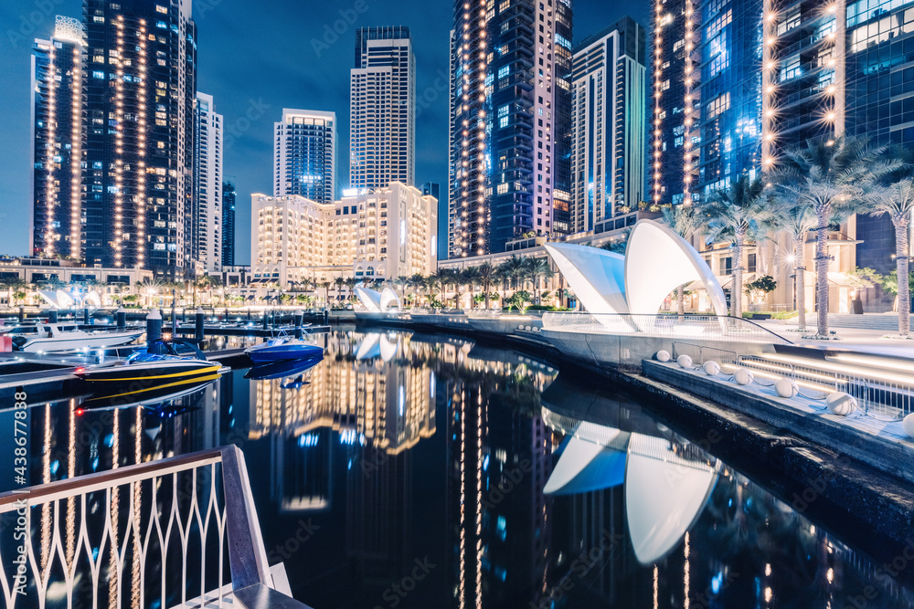 White shell arch and hotel and residential buildings in the new Dubai ...