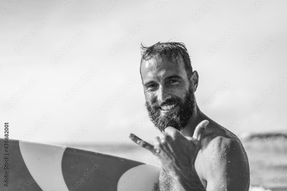 Surfer happy with surf surfing smiling doing hawaiian shaka hand sign ...