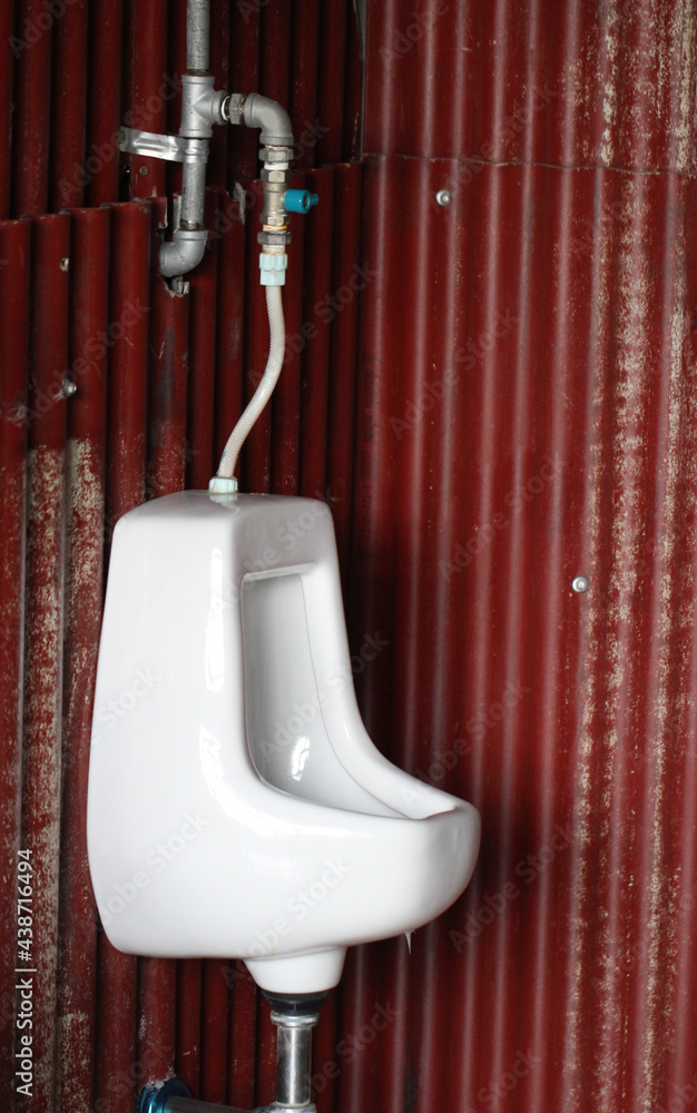 Close-up of urinal for men retro style in public toilet room, furniture ...