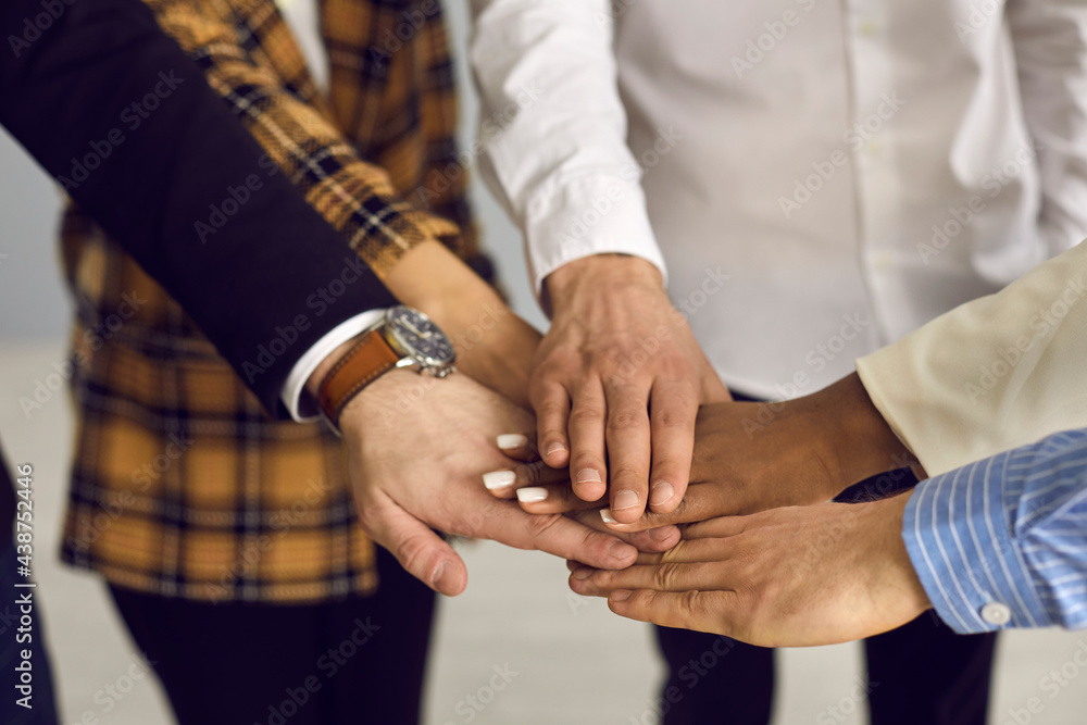 Group of people putting hands together. Diverse aspiring business team ...