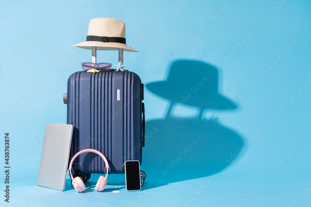 A suitcase is placed on a blue background Stock Photo | Adobe Stock