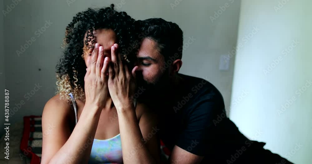 Hispanic couple consoling each other. Partner helping woman emotional ...
