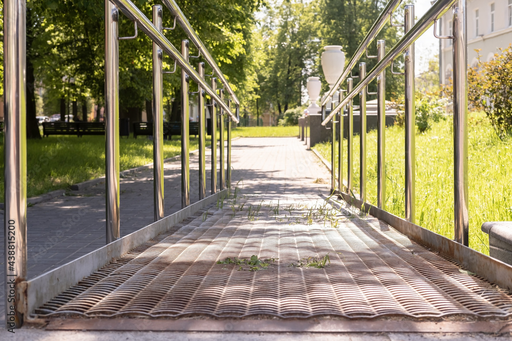 Metal ramp with handrails, an inclined plane for wheelchairs and carts ...