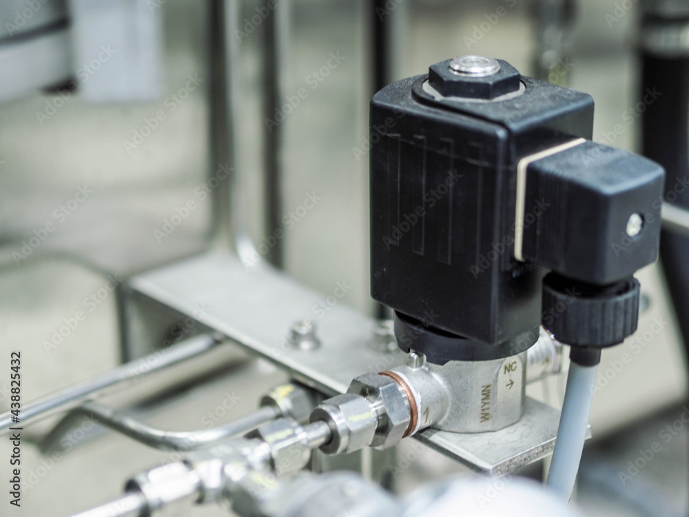 Solenoid valve of water pipe line in sampling analyzer room at power ...