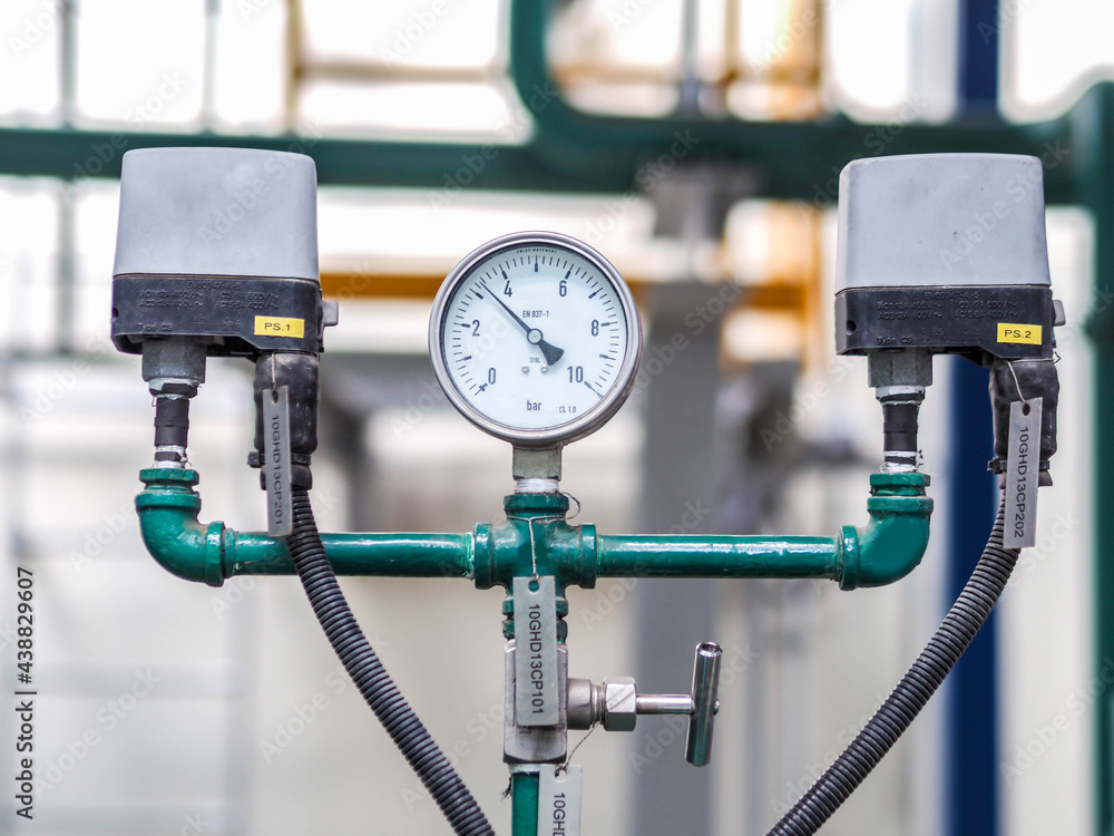 Pressure gauge of measuring instrument close up in industry zone at ...