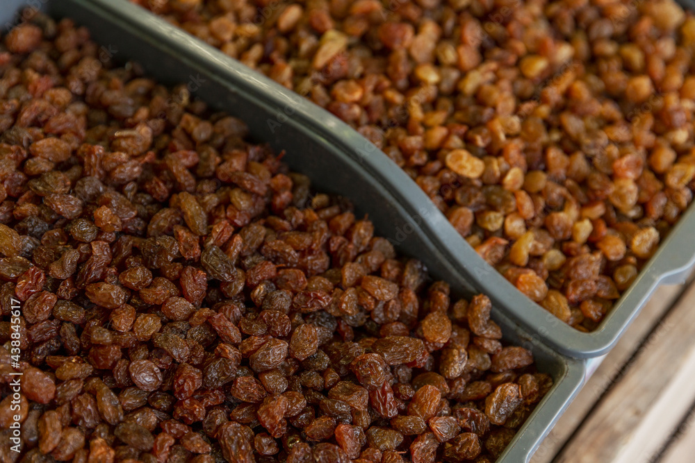 Raisins in boxes on the market counter. Top view. Healthy food and ...
