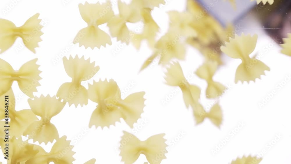 Pasta falling from package on a transparent background, filling the ...