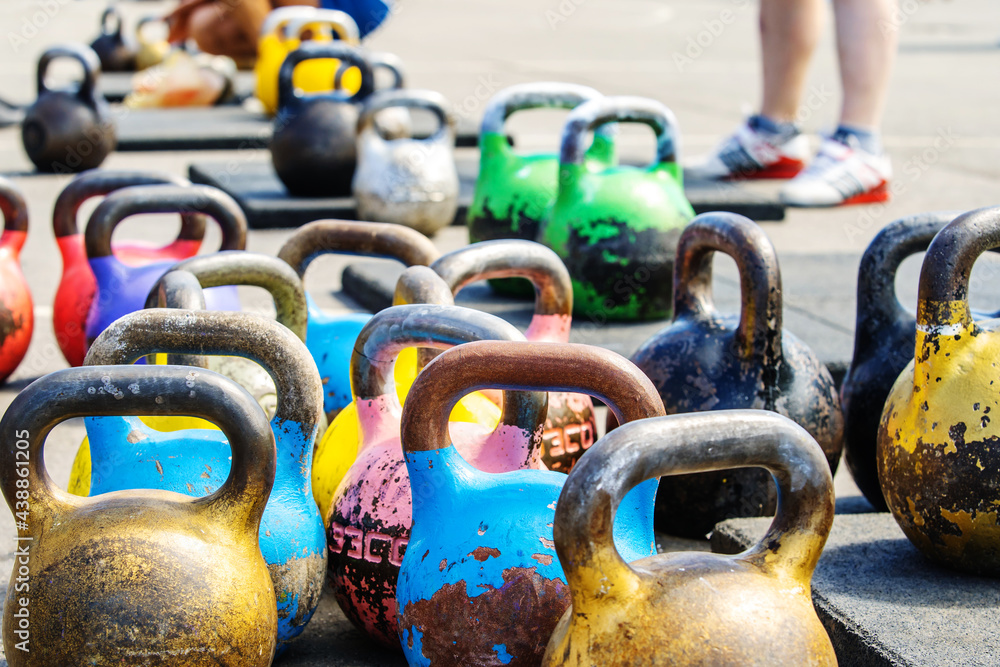 Weight-lifting. In the open area, there are many cast iron weights for ...