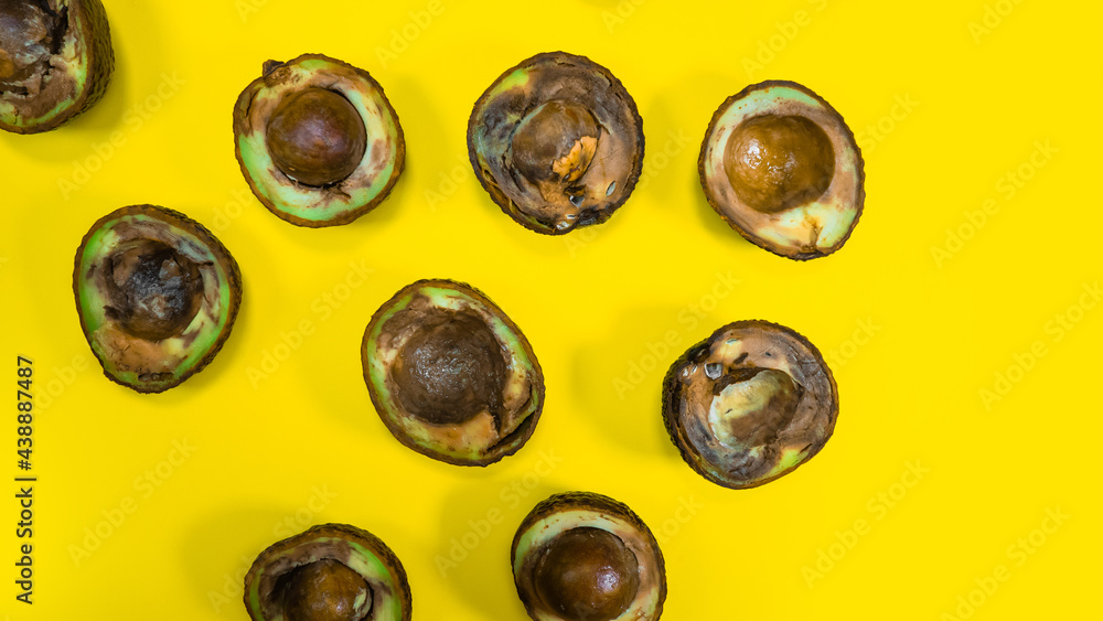 Many Bad Avocado halves on Yellow Background. Food Fruits cannot be ...