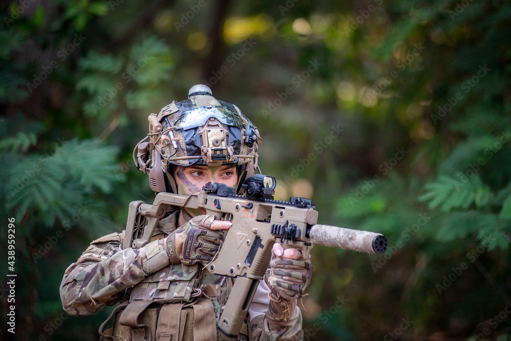 Female soldier is ready for fighting with gun. War, soldier army, gun ...