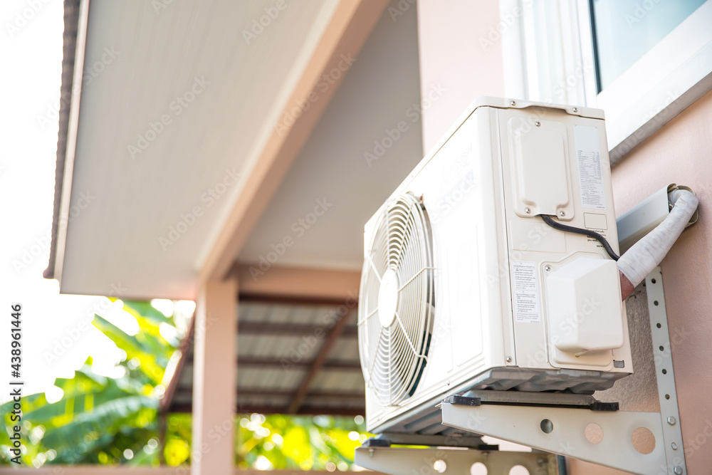 Air compressor, Close-up external split wall type of outdoor home air ...