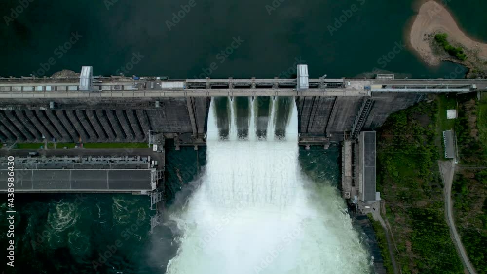 water flow, waterfall draining water from the dam, due to the overflow ...