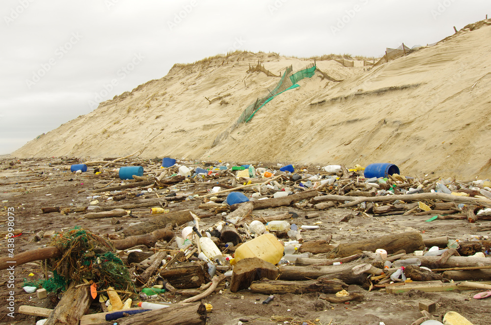 Trash water pollution. Plastics and wastes accumulates on the beach of ...