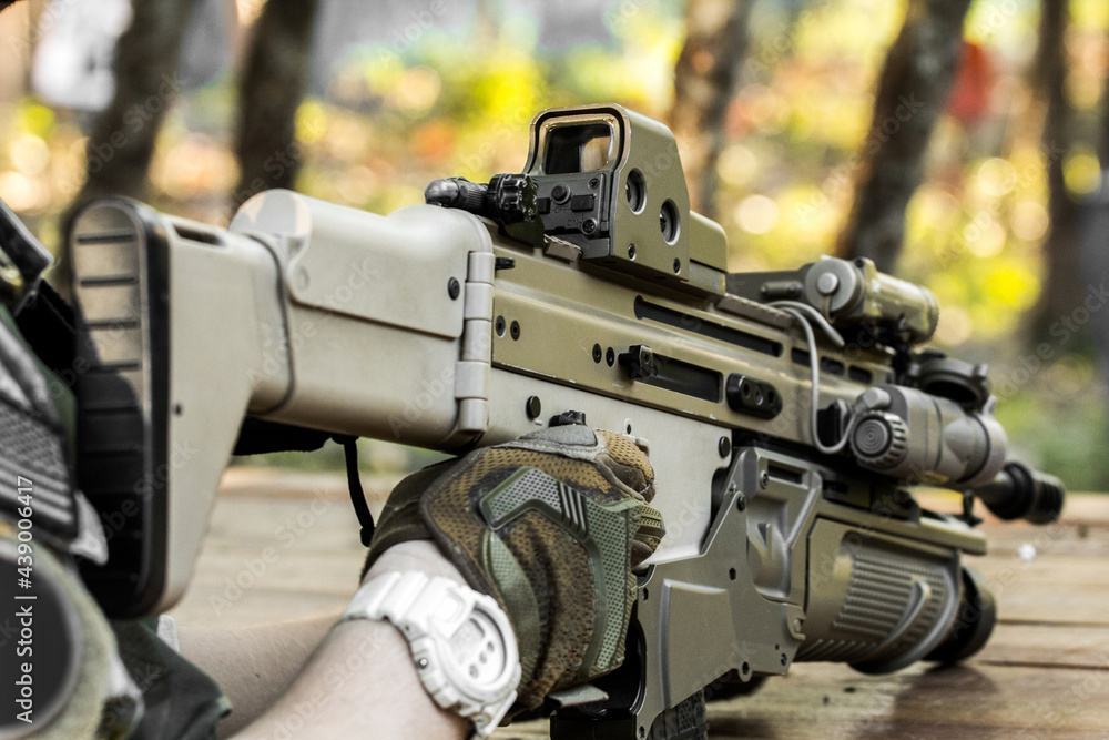 Shooter with assault scar rifle at target Stock Photo | Adobe Stock