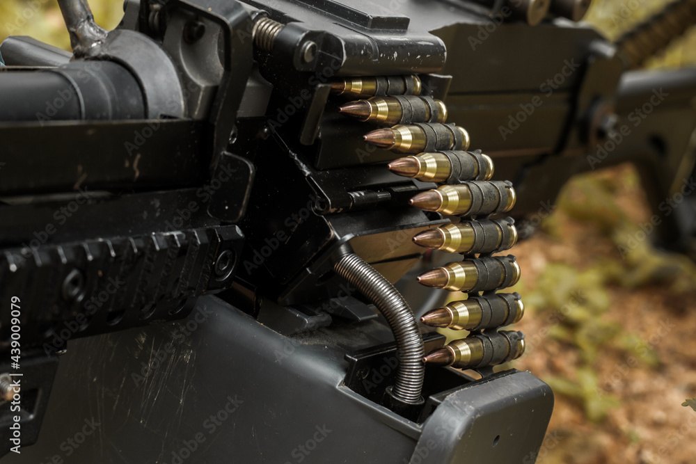 M249 light machine gun with 7.62 mm cartridge belt black and white ...