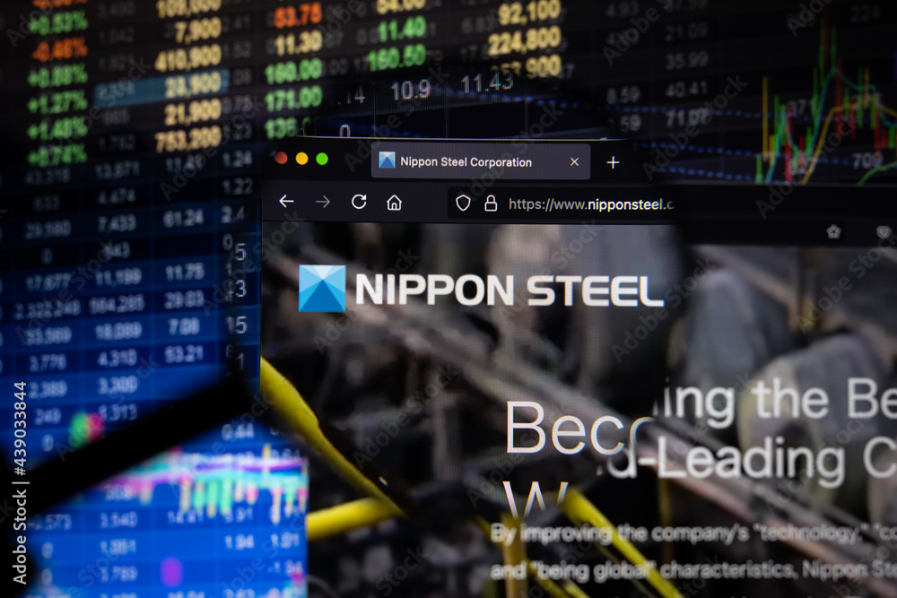 Nippon Steel company logo on a website with blurry stock market ...