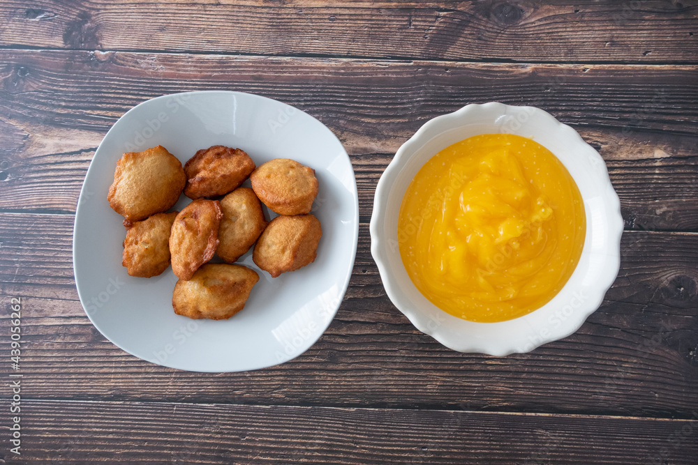 Nigerian Deep Fried Akara beancake served with Custard Stock Photo ...