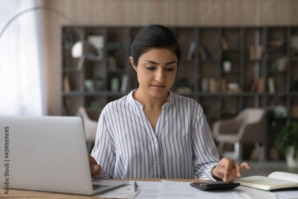 Accountant at work. Focused indian female auditor prepare analytic ...