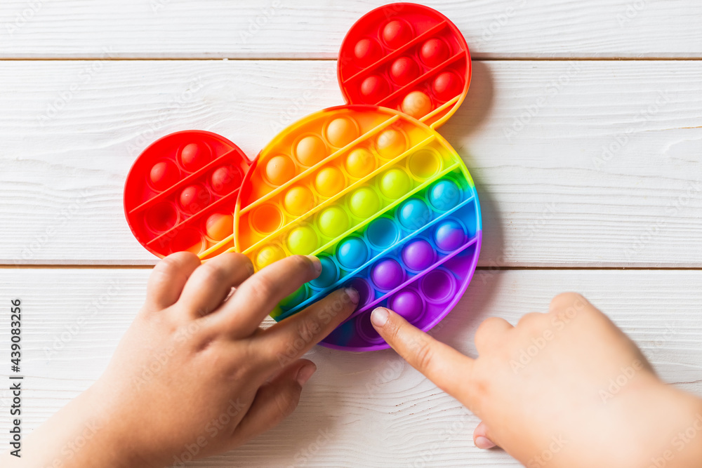 A child plays with a flapping fidget. popular children's flexible ...