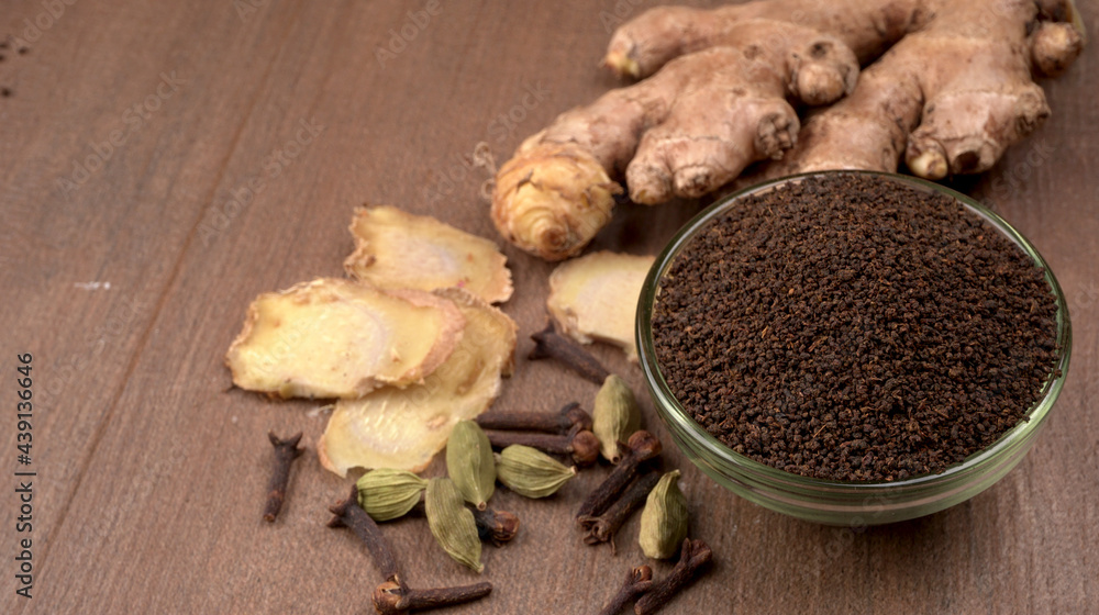 Black Tea Powder or dry dust tea powder, chai patti isolated in wooden ...