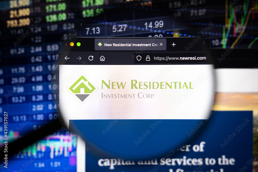 New Residential Inv company logo on a website with blurry stock market developments in the ...