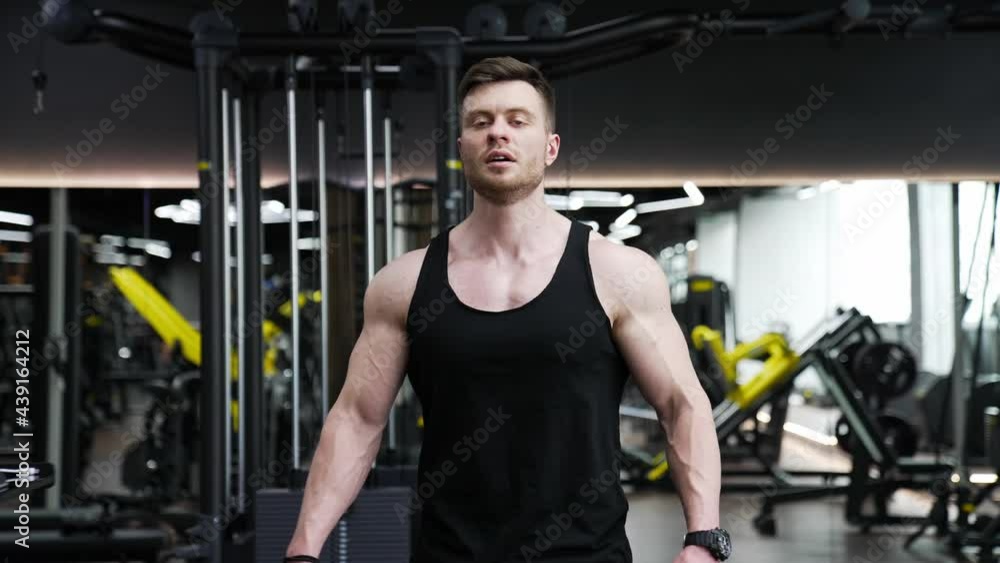 Vídeo do Stock: Portrait of a handsome bodybuilder. Young athlete with ...