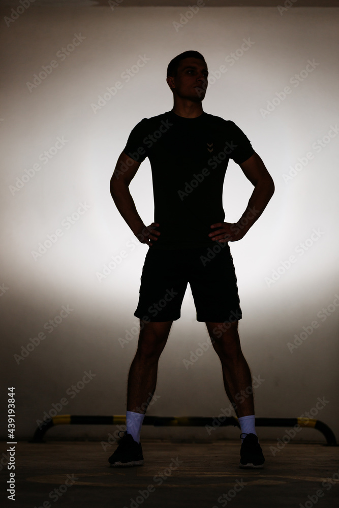 Dark silhouette of a strong man body on white background. Confident ...