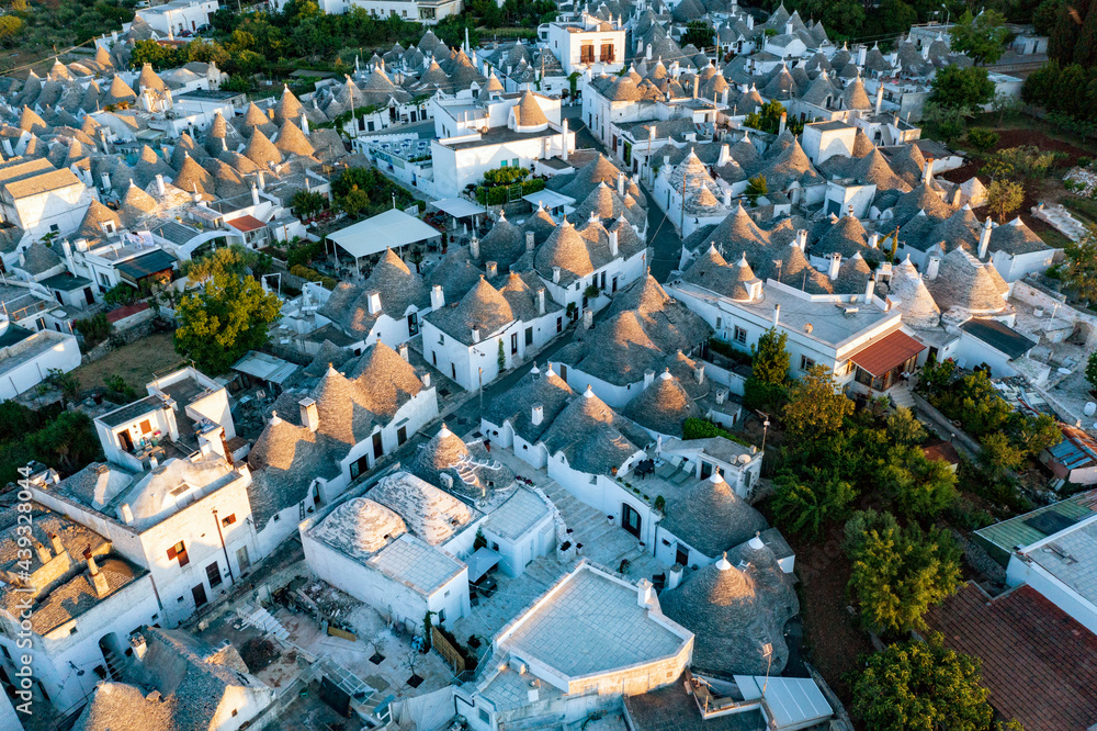 Aerial view of alberobello at sunset, the city of trulli in Puglia. a ...